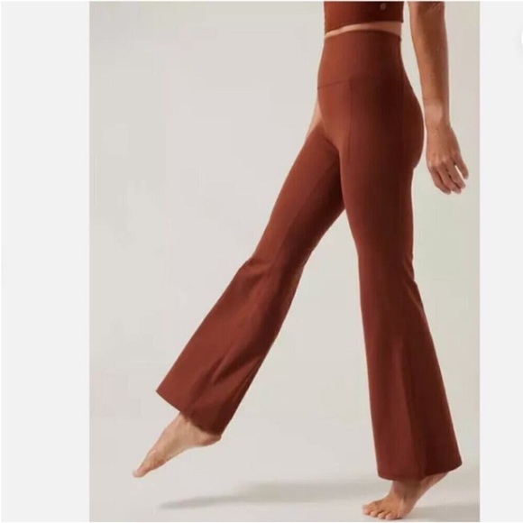Athleta | Pants & Jumpsuits | Athleta Salutation Stash Flare Pant Rust ...
